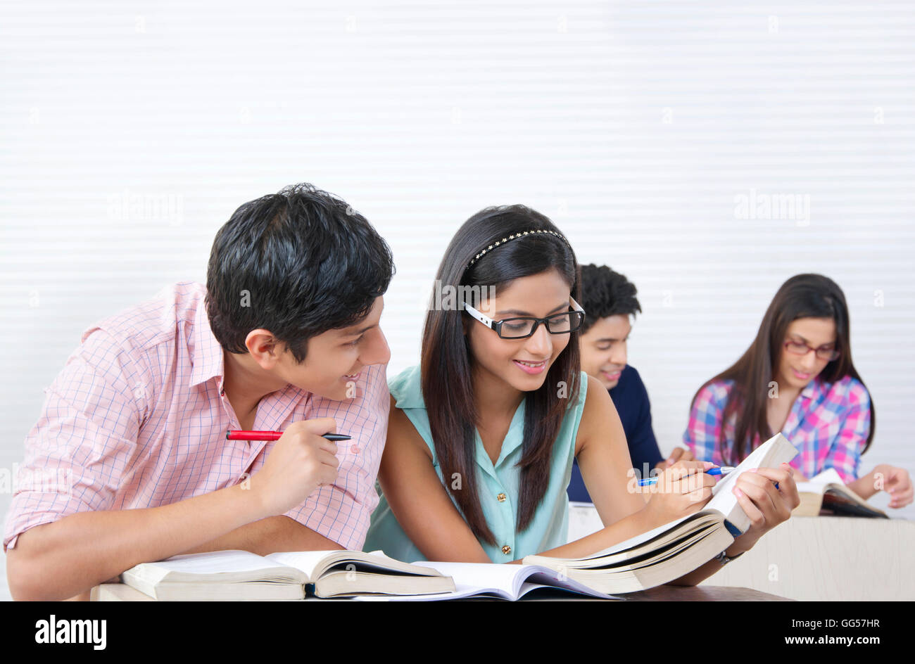 Young college students studying in classroom Stock Photo - Alamy