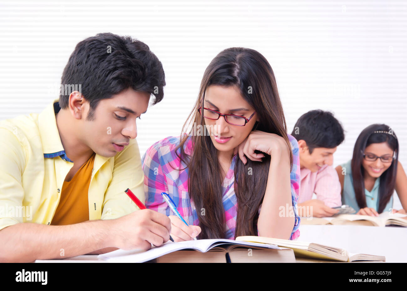 Young college friends studying in lecture hall Stock Photo - Alamy