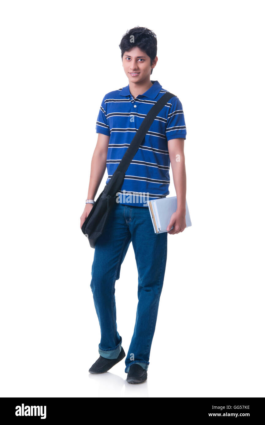 Full length portrait of confident male student with books and bag ...