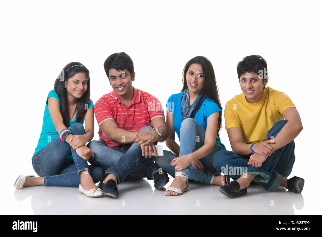Full length portrait of happy friends siting over white background ...