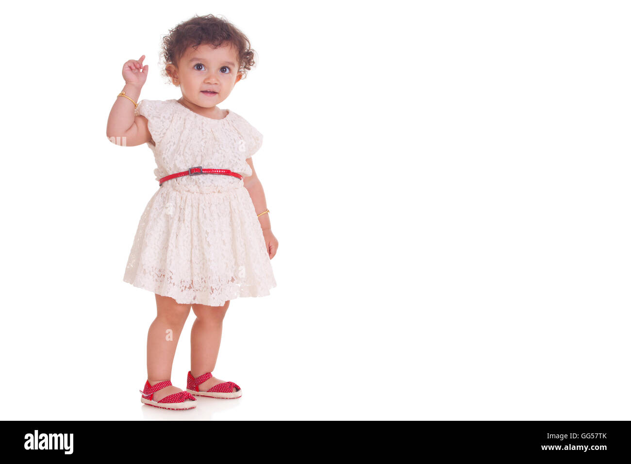 Full length of innocent girl against white background Stock Photo - Alamy