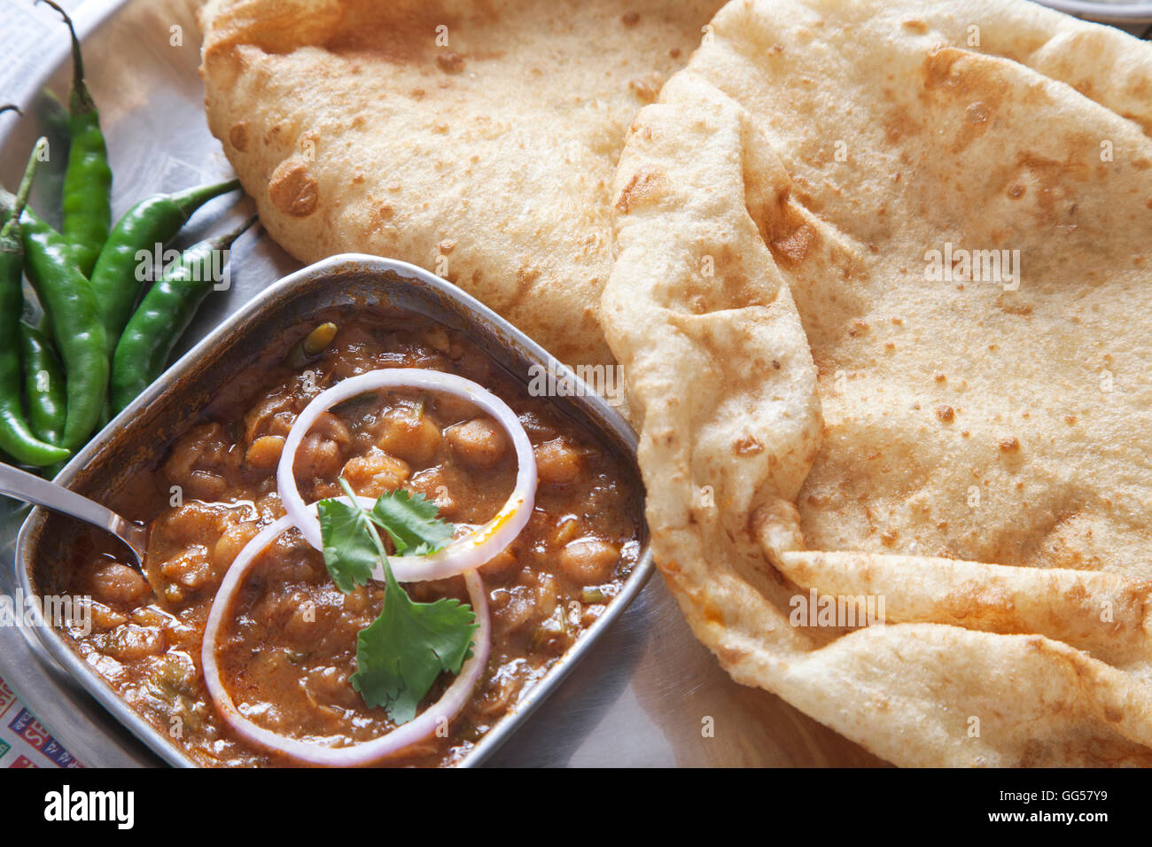 Indian eating chole bhature hi-res stock photography and images - Alamy