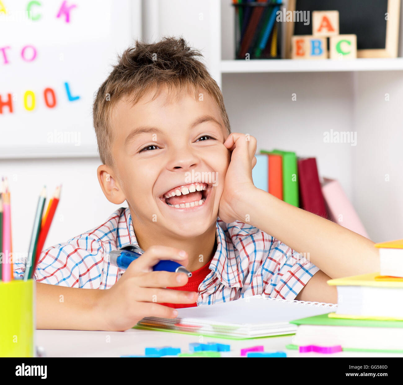Boy doing homework Stock Photo - Alamy