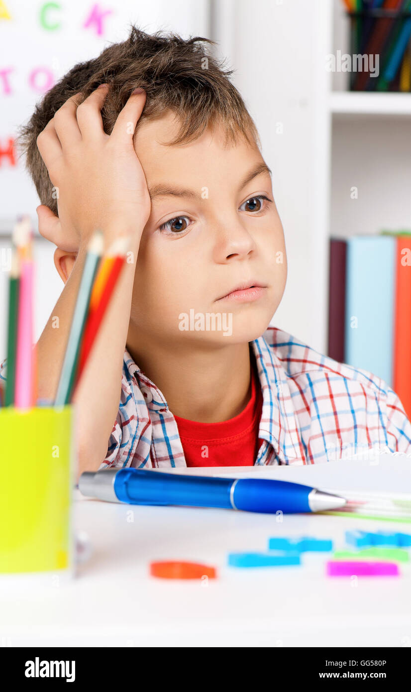 Boy doing homework Stock Photo - Alamy