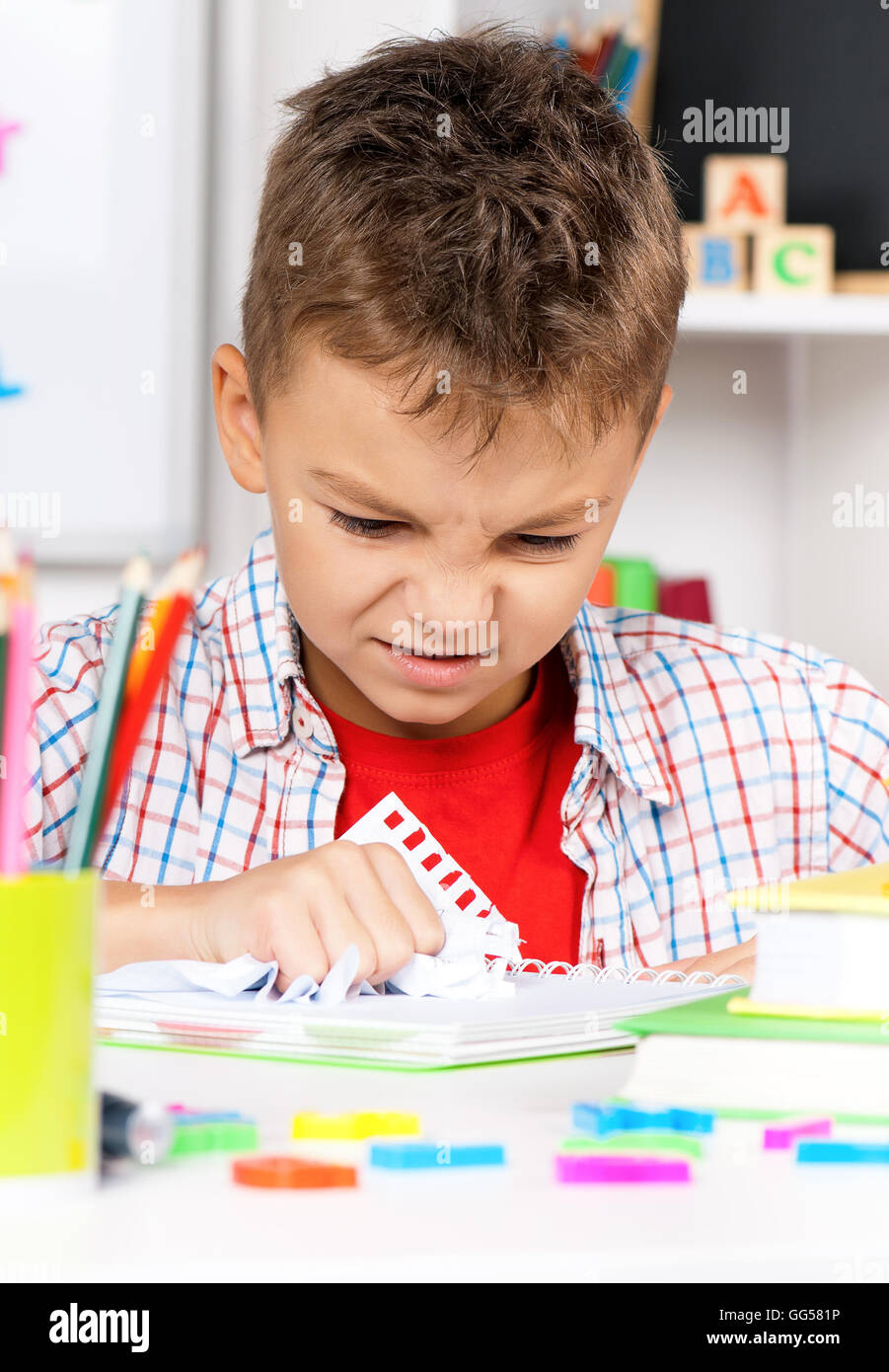 Boy doing homework Stock Photo - Alamy
