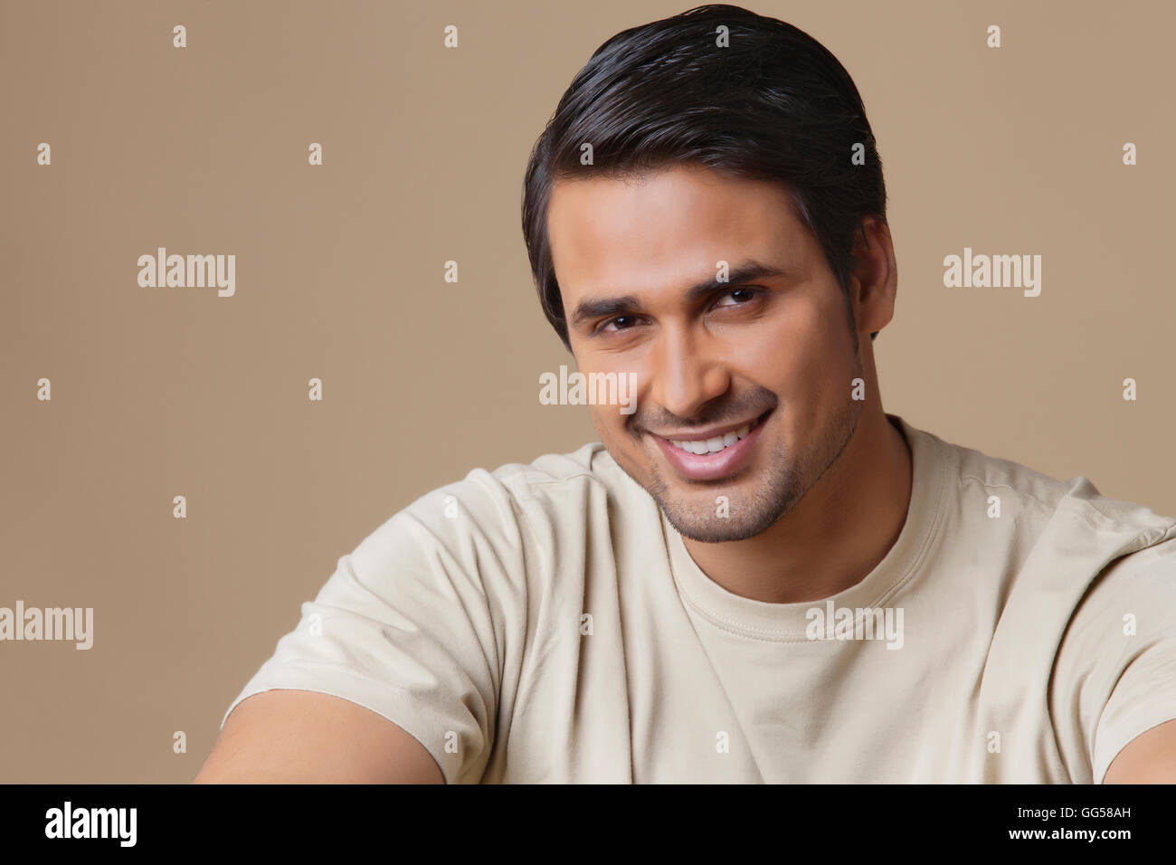 Portrait of happy Indian man over colored background Stock Photo - Alamy