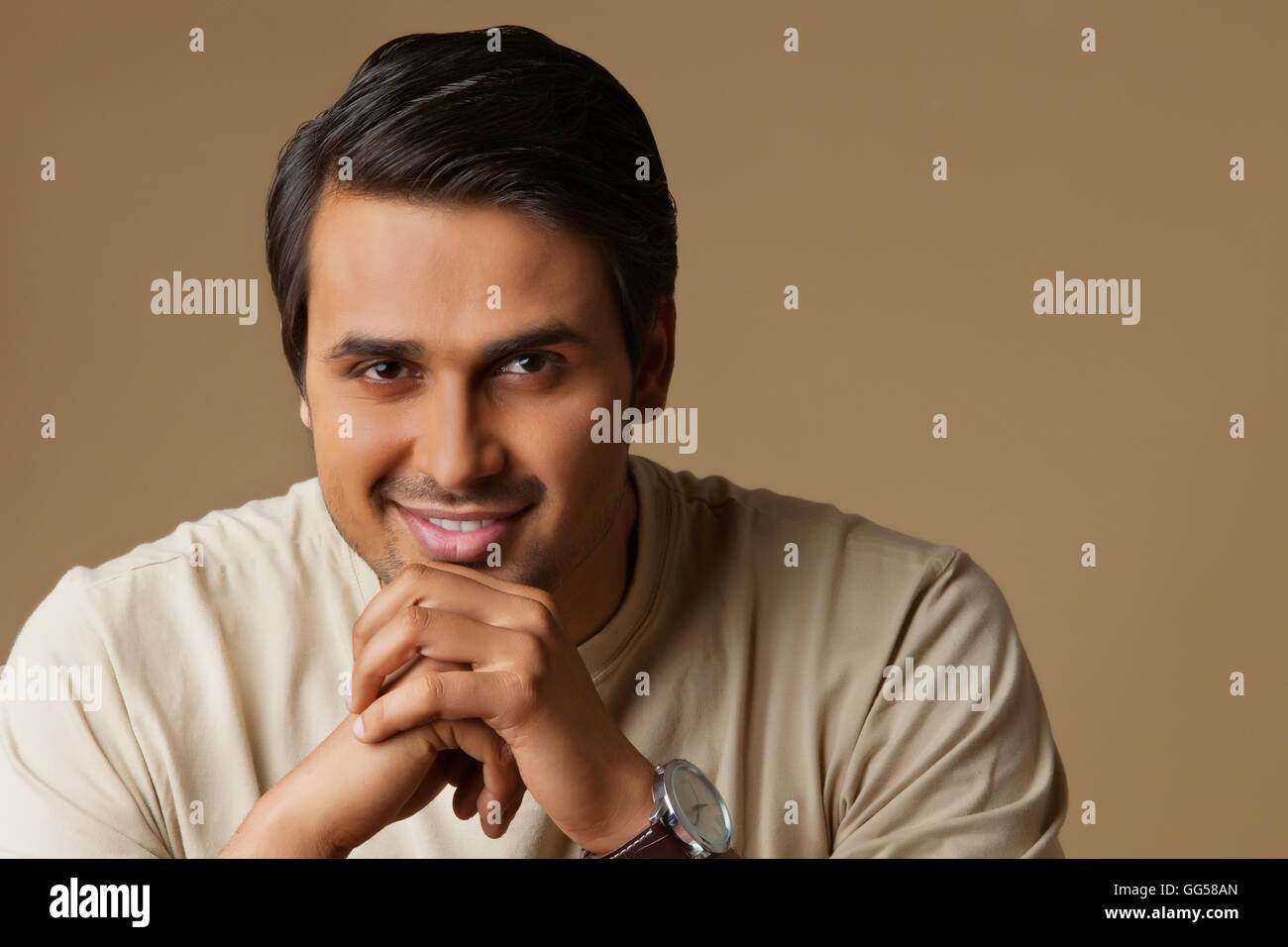 Portrait of confident Indian man on colored background Stock Photo - Alamy