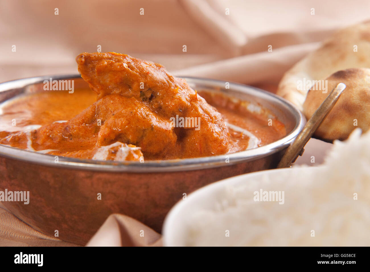 Butter chicken served in container Stock Photo - Alamy