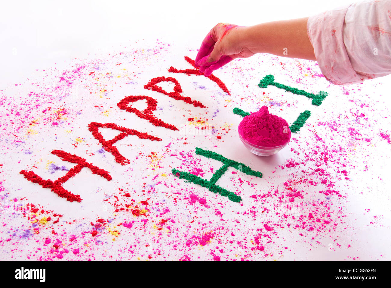 Hand writing HAPPY Holi with gulal over white background Stock Photo ...