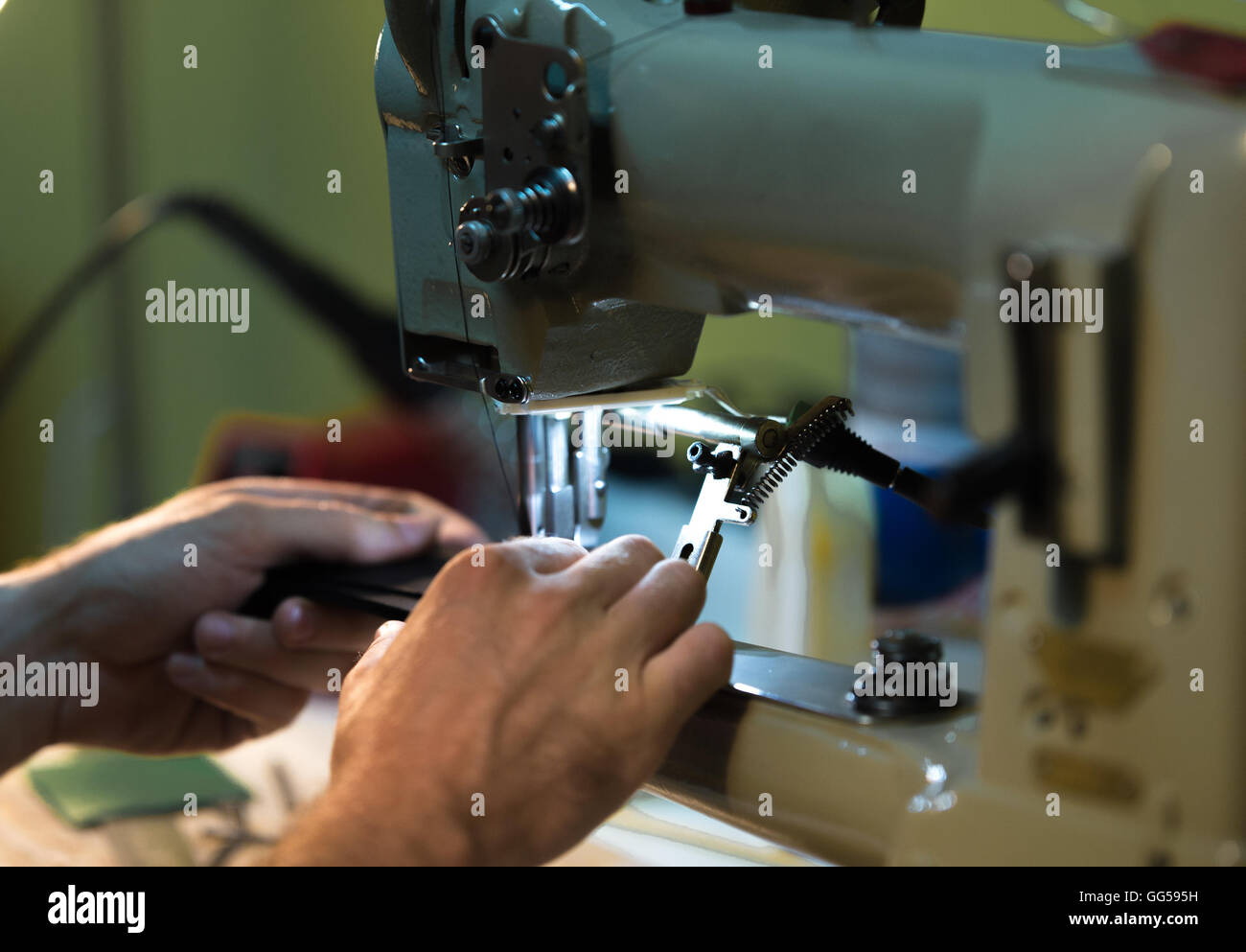 Sewing on the sewing machine - Working close up Stock Photo - Alamy