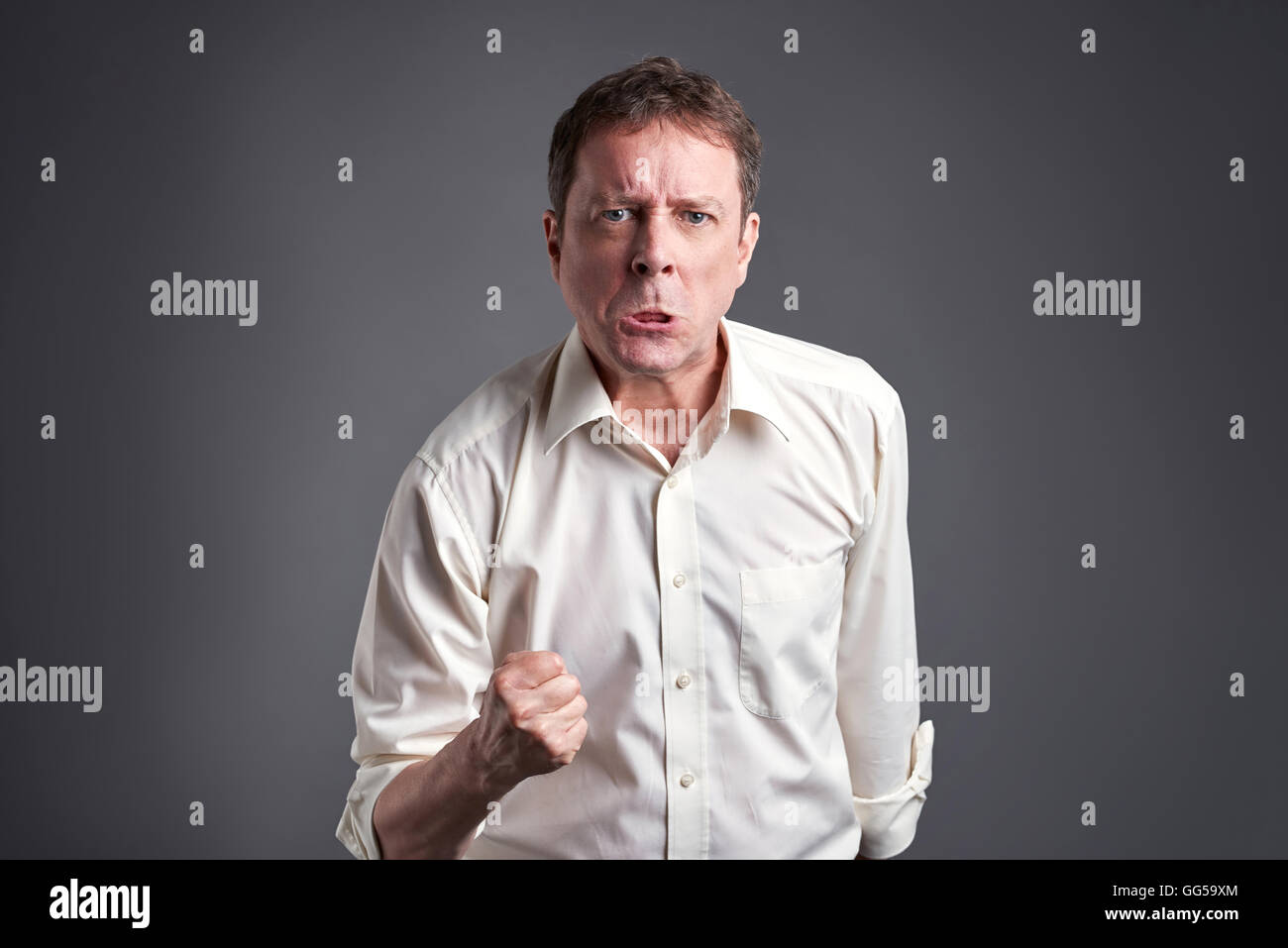 Portrait of a angry middle age man getting fury Stock Photo - Alamy