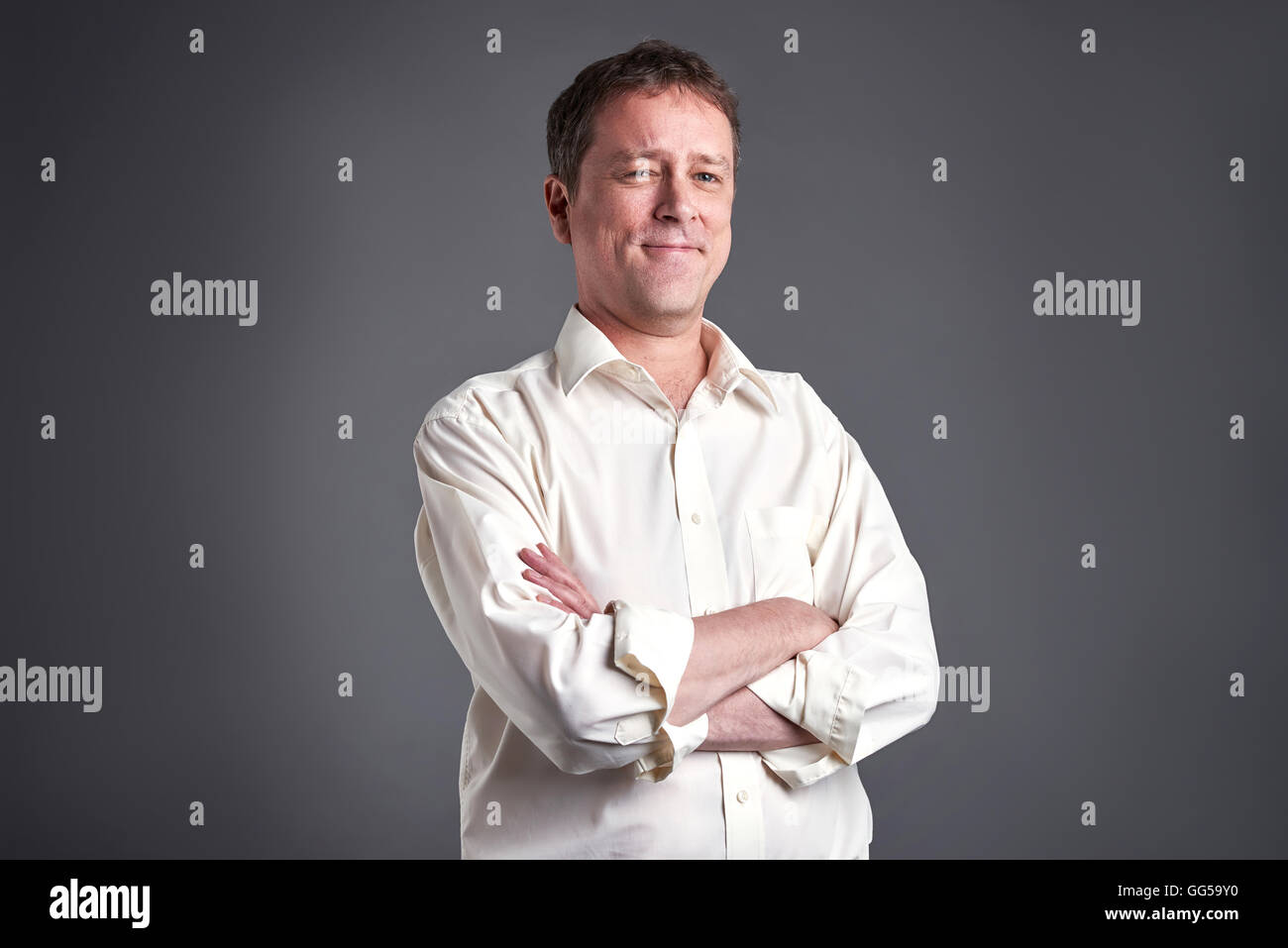 Portrait of a happy middle age man smiling Stock Photo - Alamy