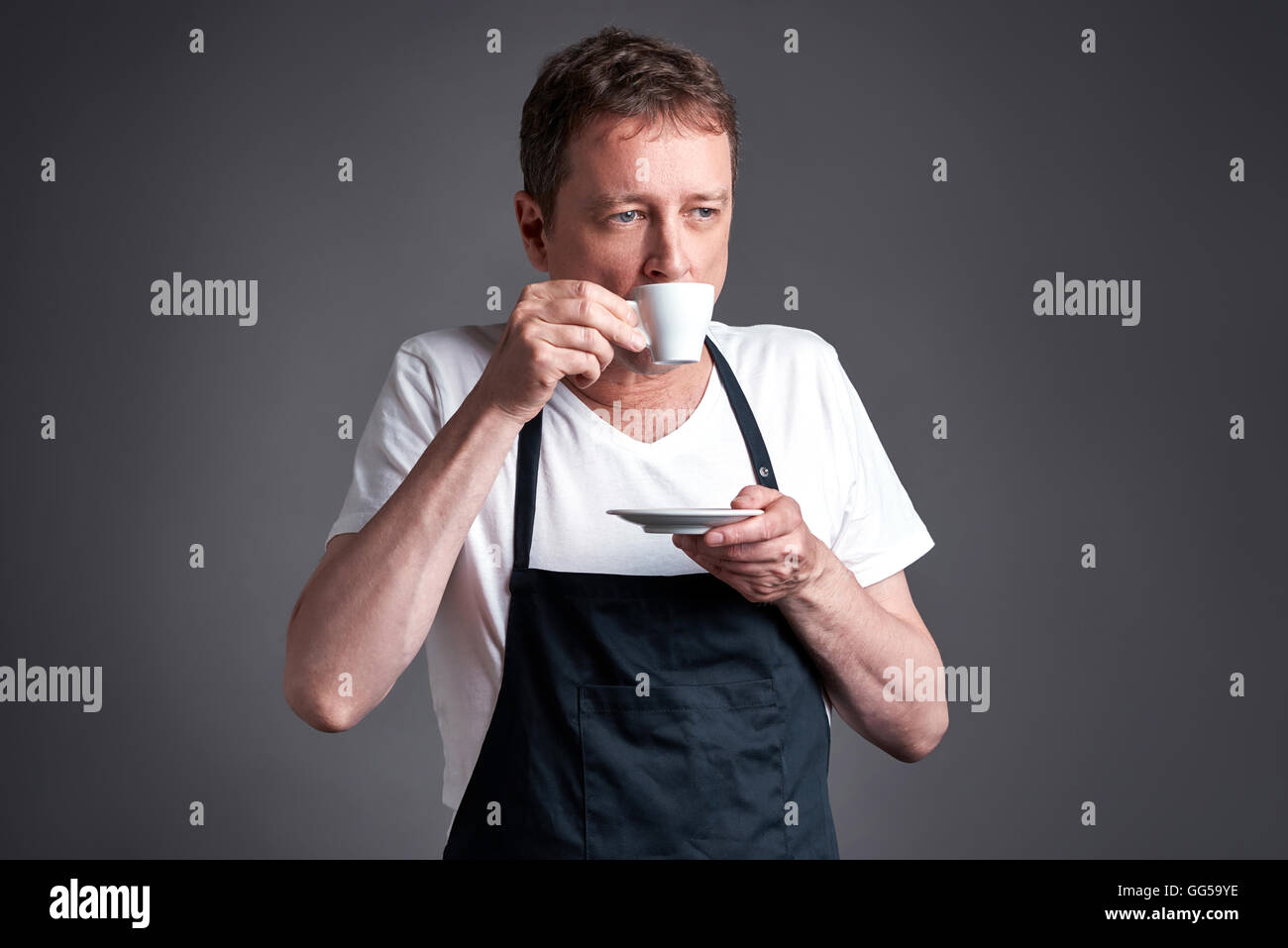 A middle age man smelling a cup of coffee Stock Photo - Alamy