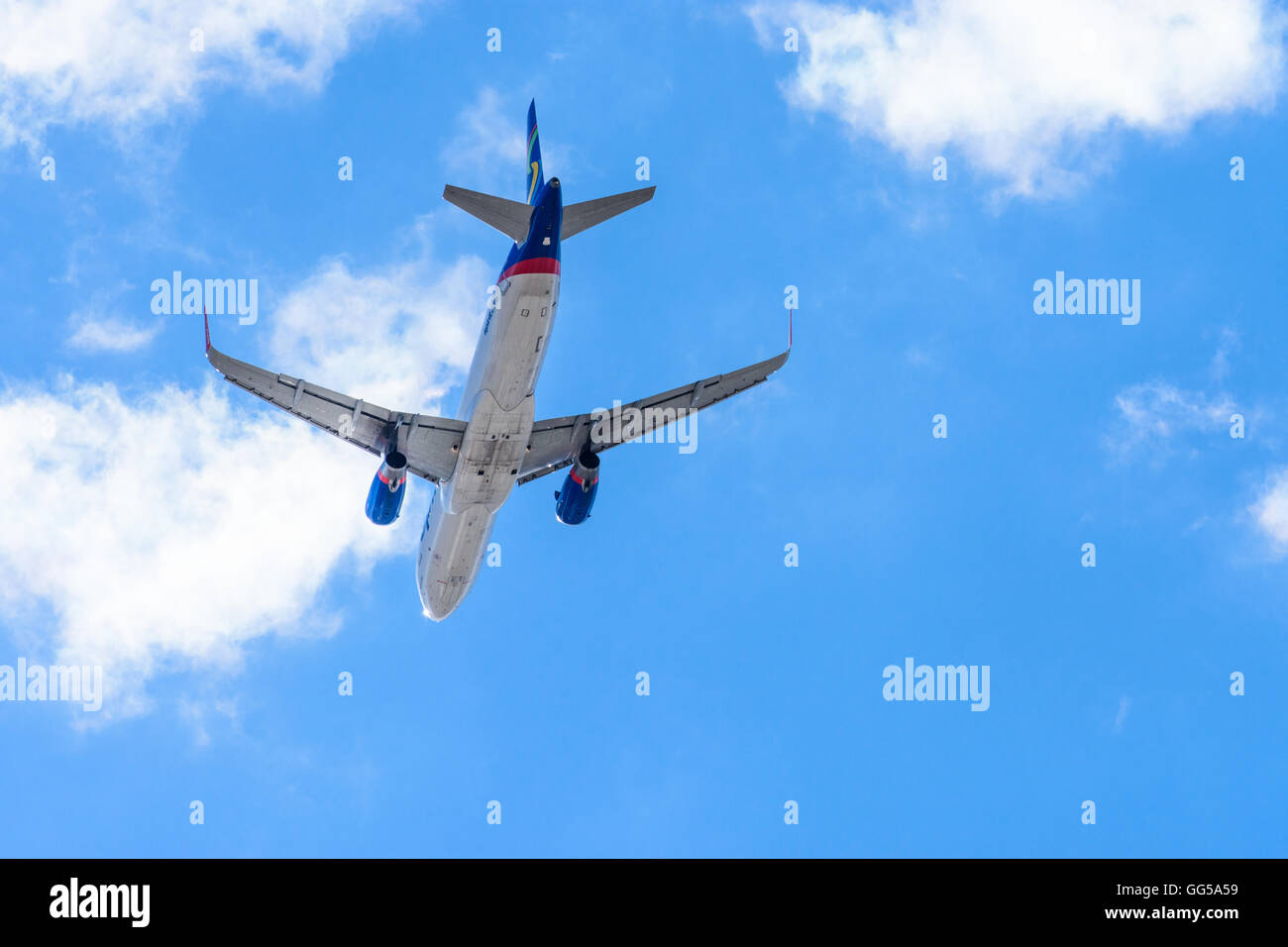 Looking up to a Spirit Airlines Airbus A320 plane flying overhead Stock ...