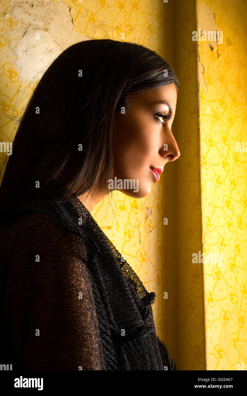 Portrait of a beautiful young woman in golden light Stock Photo - Alamy