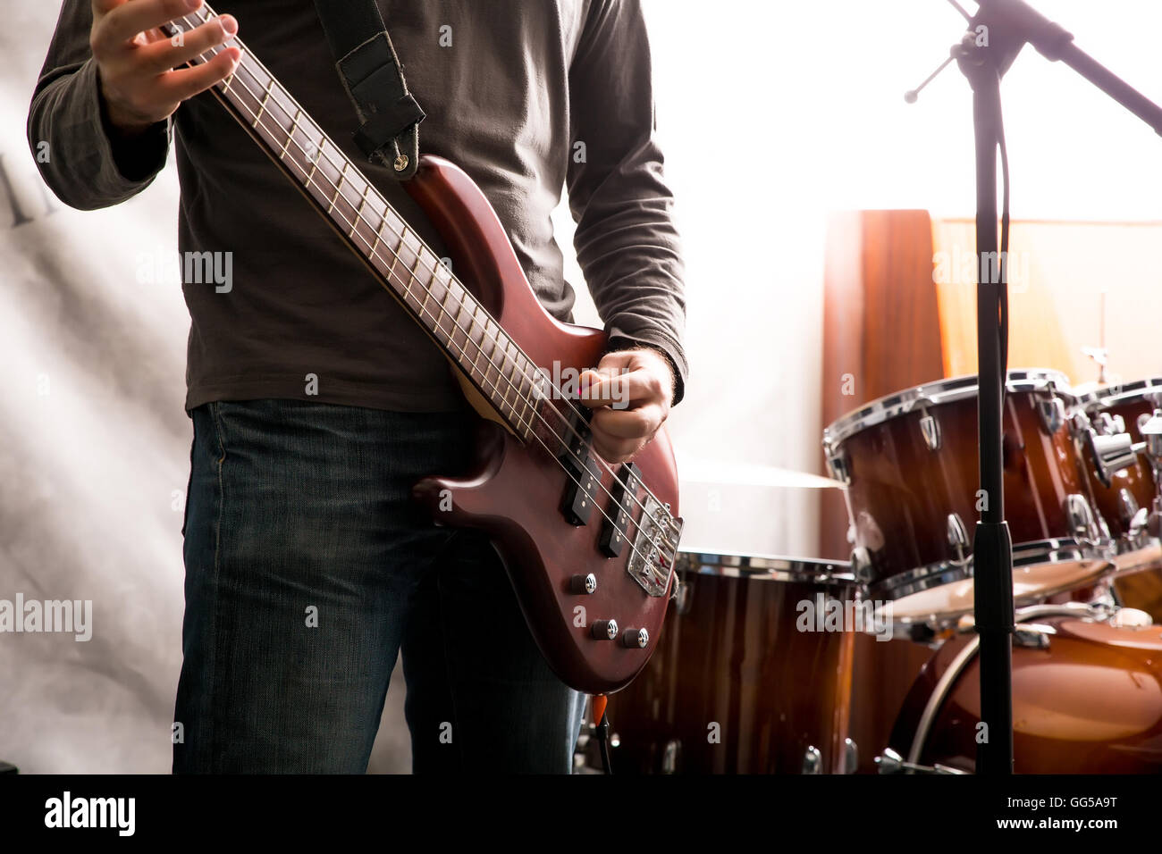 Black and white Portrait of a Rock singer playing bass in the rehearsal ...