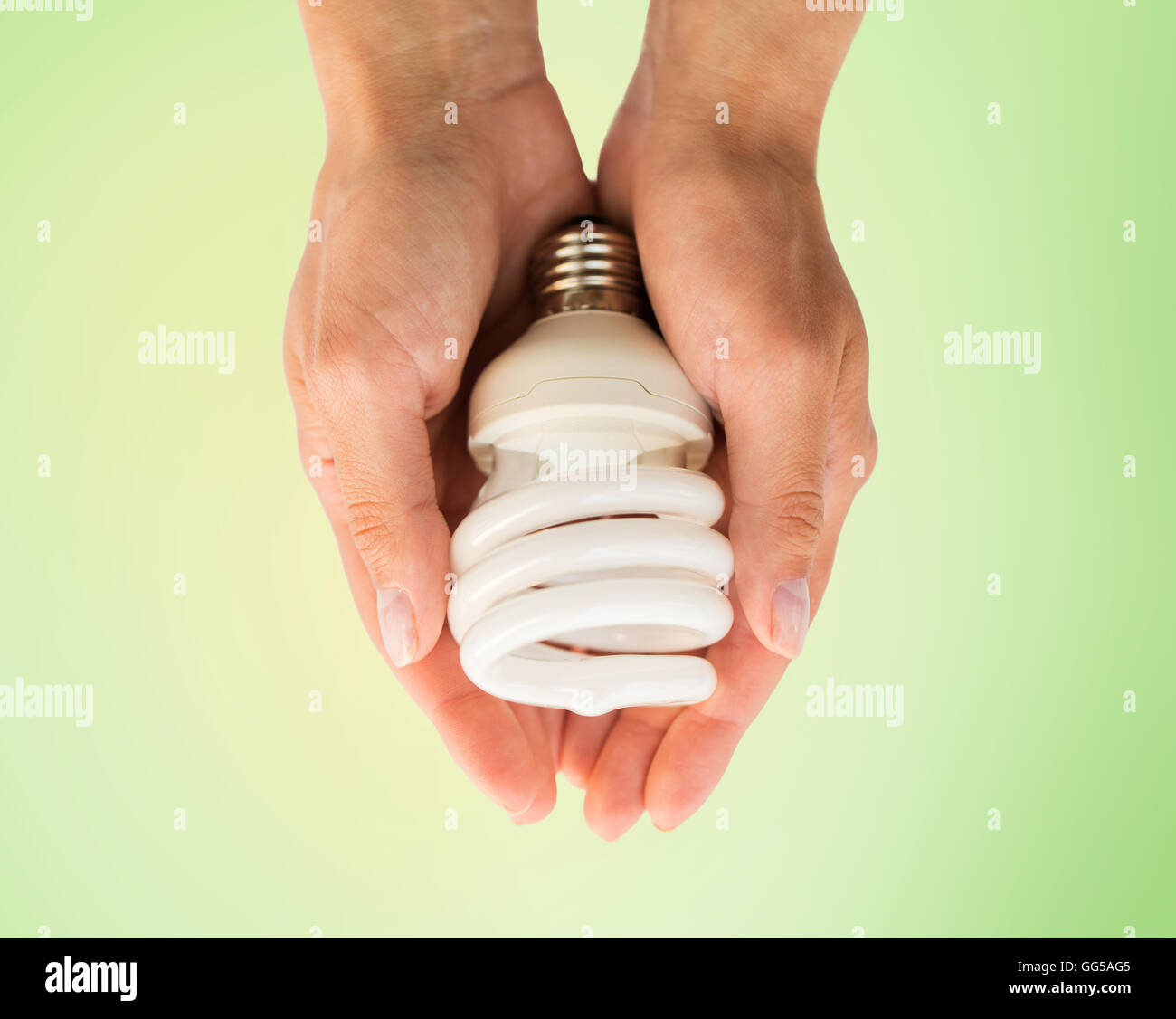 close up of hands holding energy saving lightbulb Stock Photo - Alamy