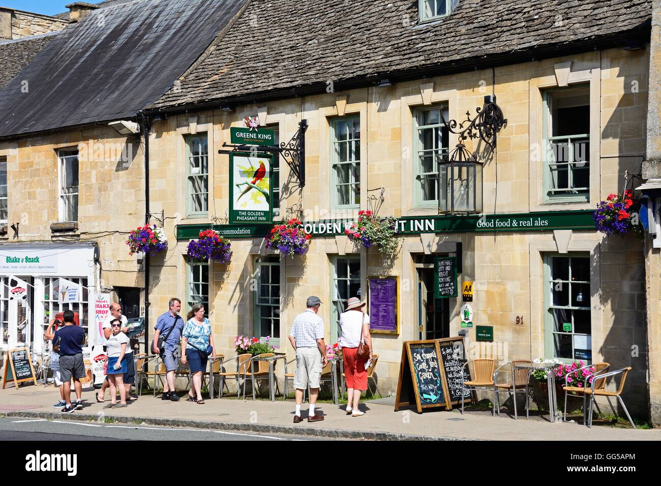 View of The Golden Pheasant Inn along The Hill shopping street with ...