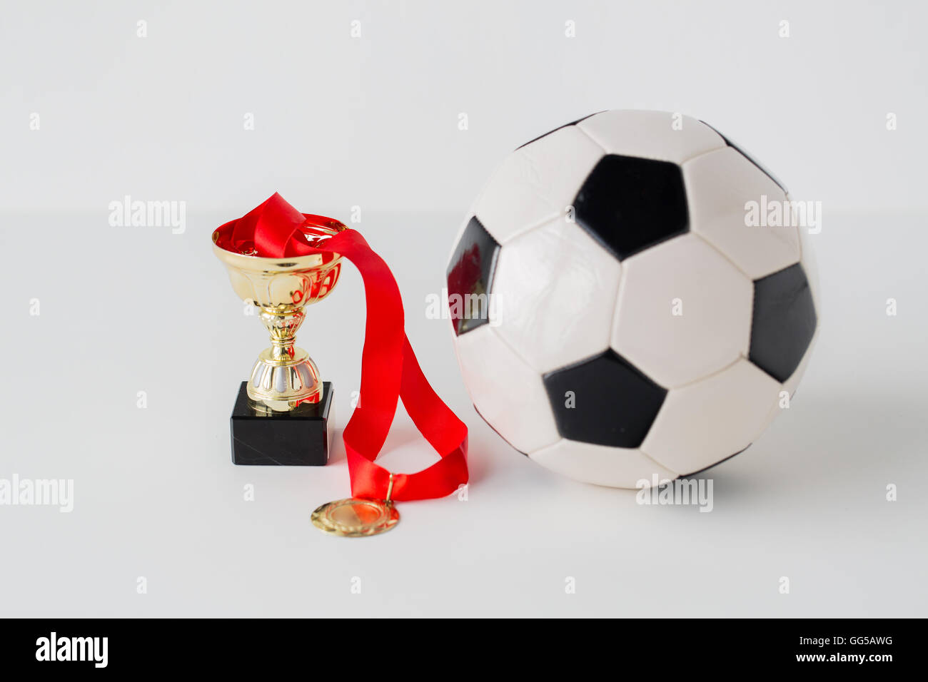 close up of football ball, golden cup and medal Stock Photo - Alamy