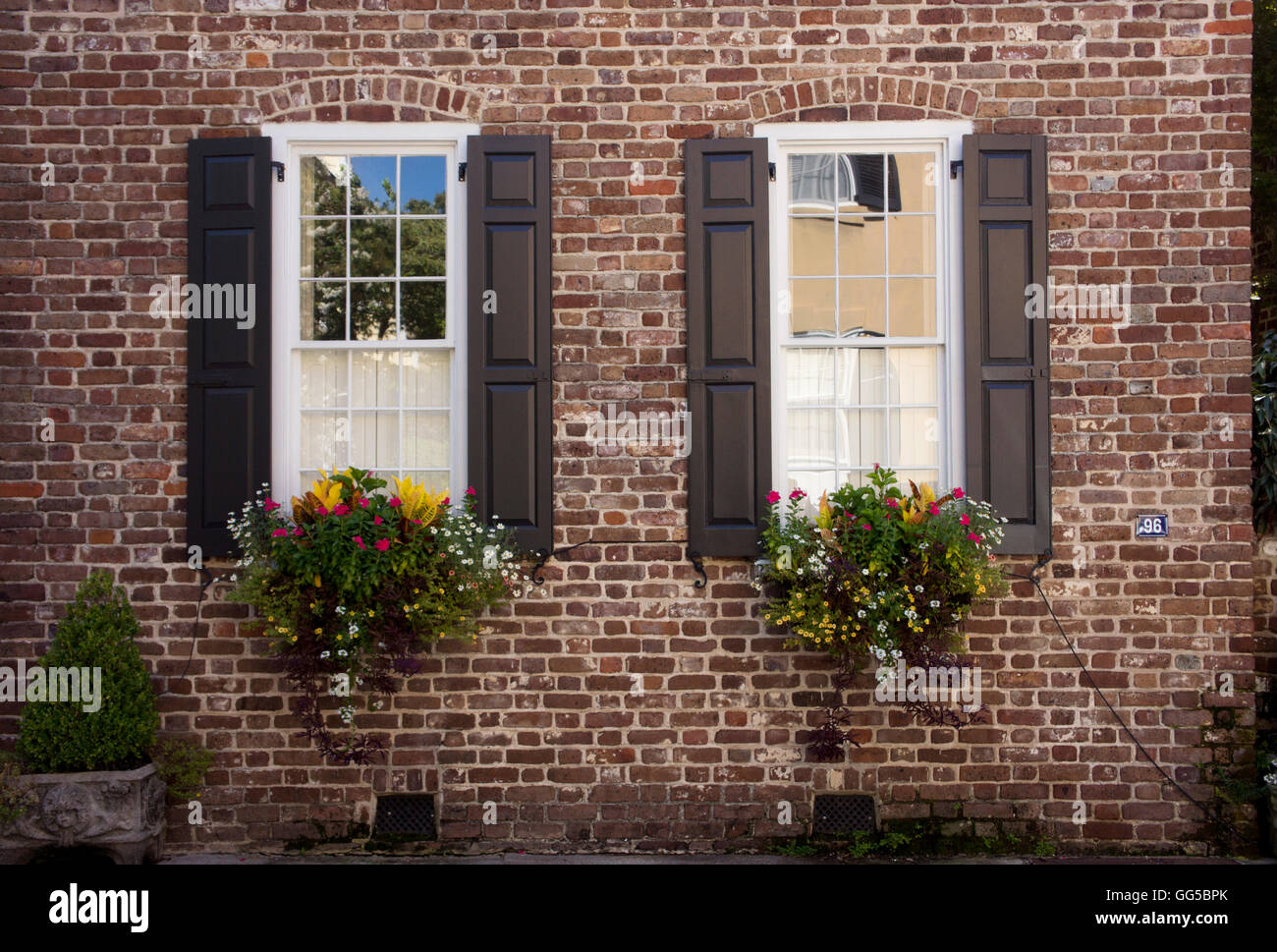 Window boxes filled with summer flowers on a Federal-style residence in ...