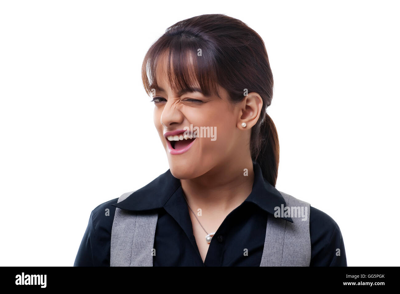 Flirtatious business woman winking on white background Stock Photo - Alamy
