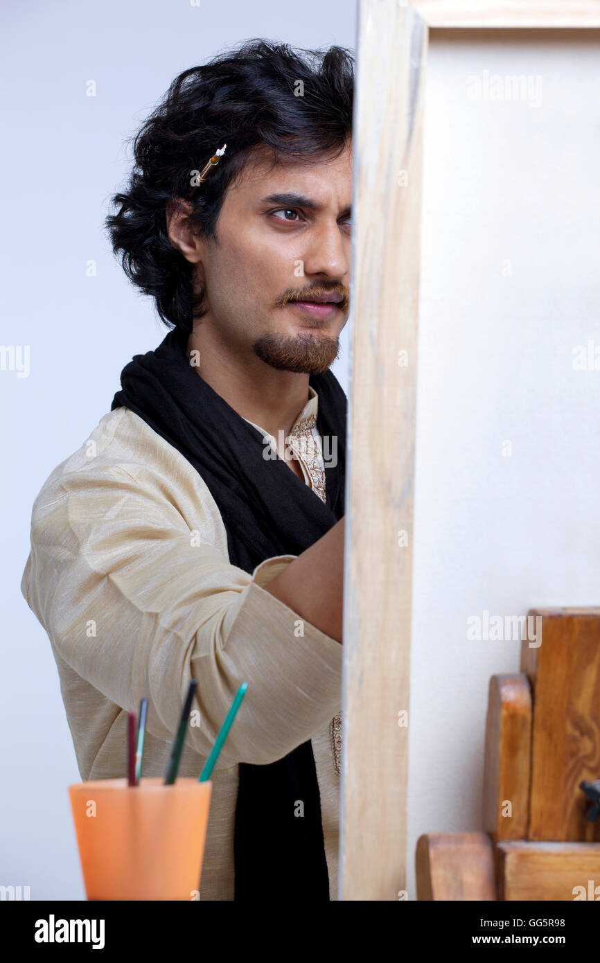 Young artist painting Stock Photo - Alamy