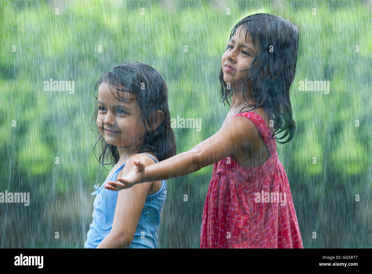 Girls standing in the rain Stock Photo - Alamy