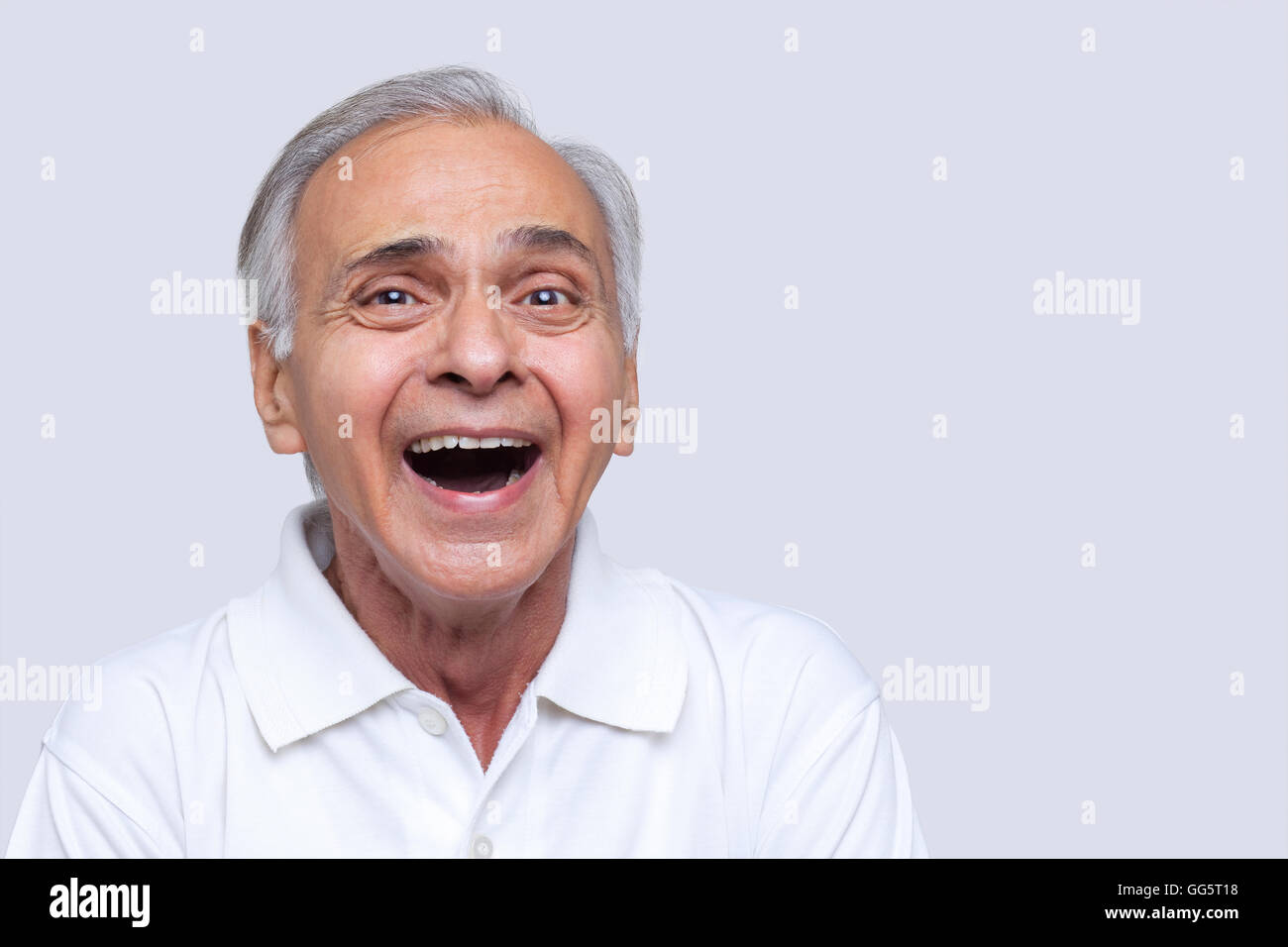 Portrait of man laughing over white background Stock Photo - Alamy