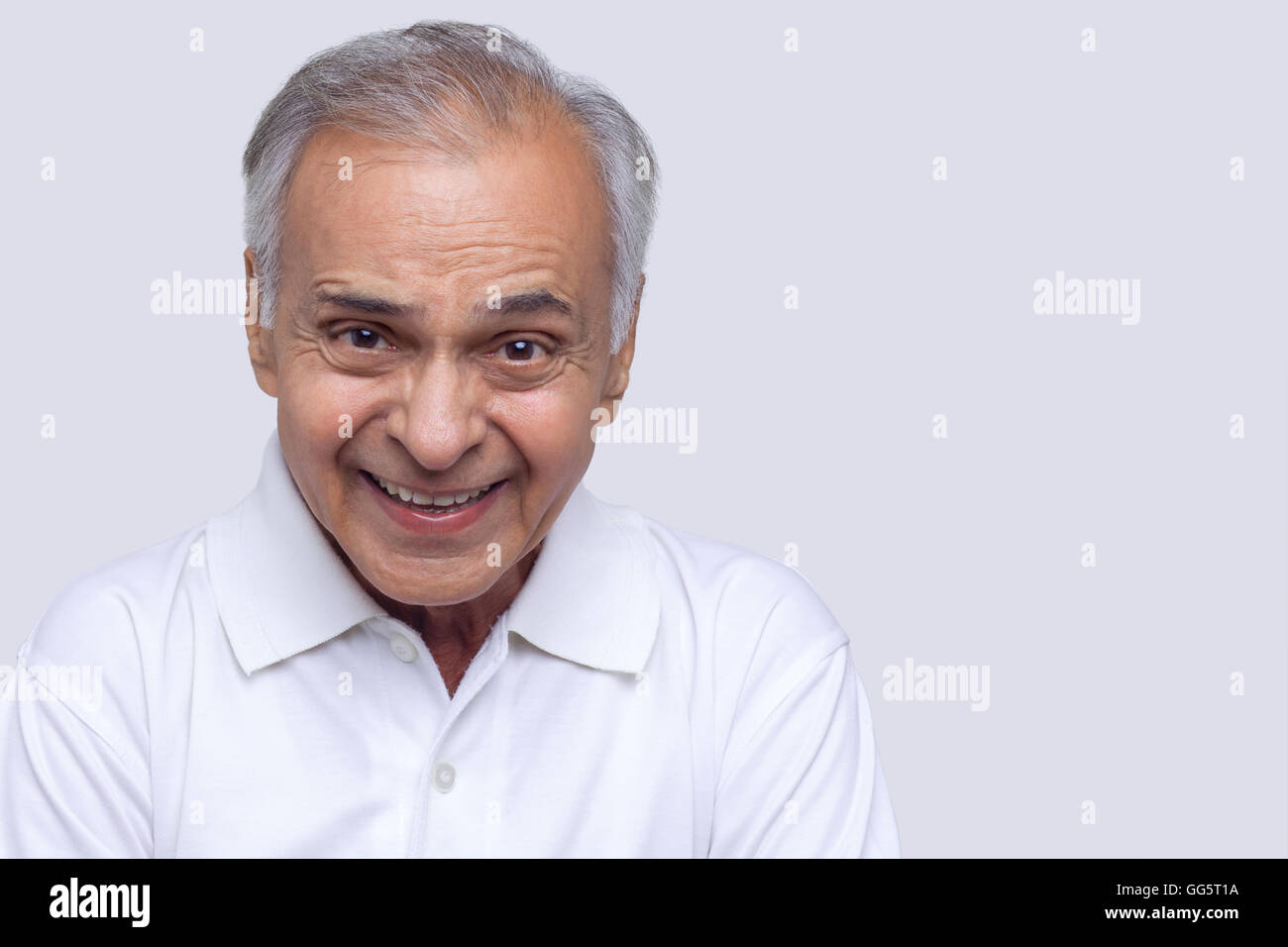 Senior man smiling over white background Stock Photo - Alamy