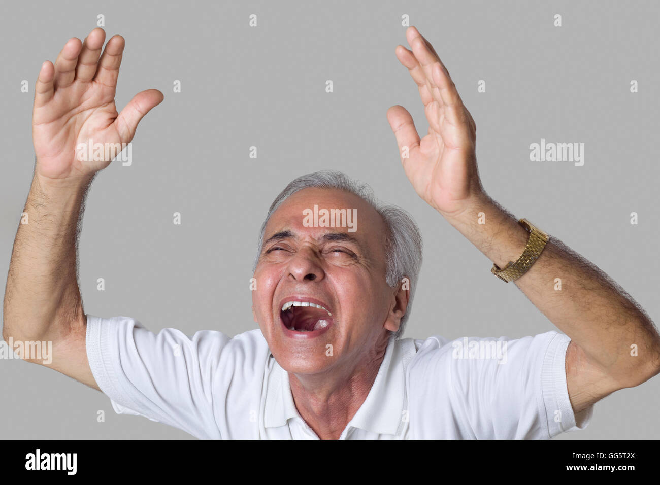 Elderly man laughing over colored background Stock Photo - Alamy