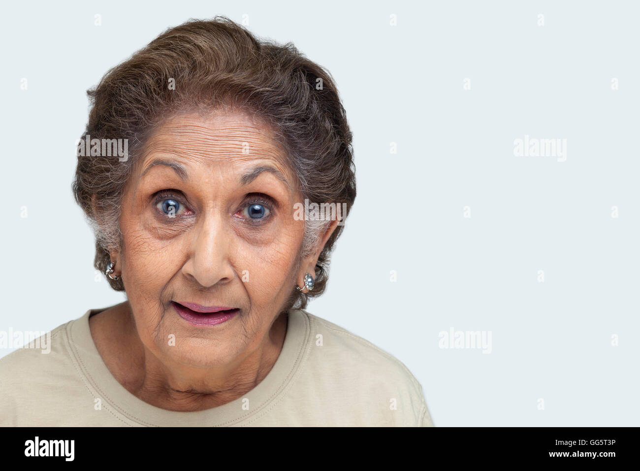 Portrait of an old woman with raised eyebrows Stock Photo - Alamy