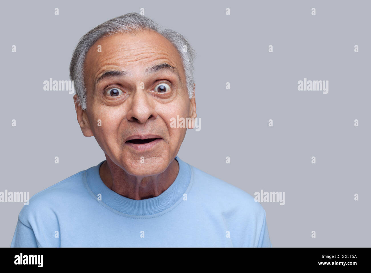 Portrait of surprised senior man raising eyebrows Stock Photo - Alamy