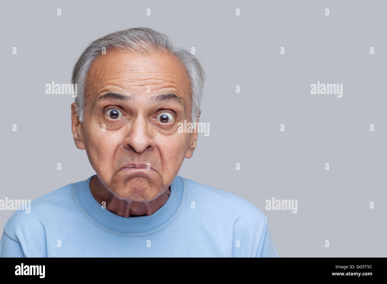 Portrait of an angry man making faces Stock Photo - Alamy