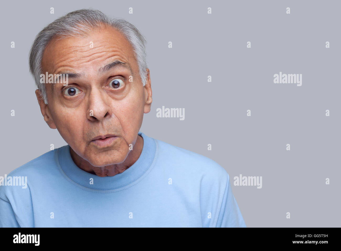 Portrait of surprised senior man Stock Photo - Alamy