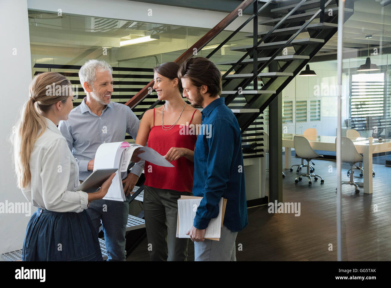 Business team reviewing a document Stock Photo - Alamy