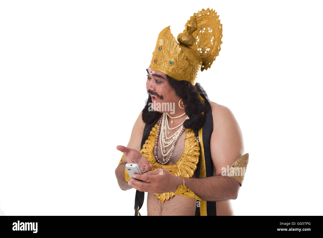 Man dressed as Raavan with a mobile phone laughing Stock Photo - Alamy