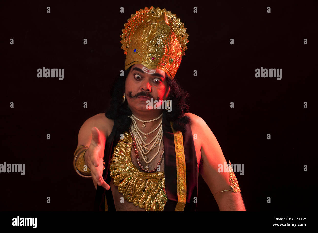 Man dressed as Raavan gesturing Stock Photo - Alamy