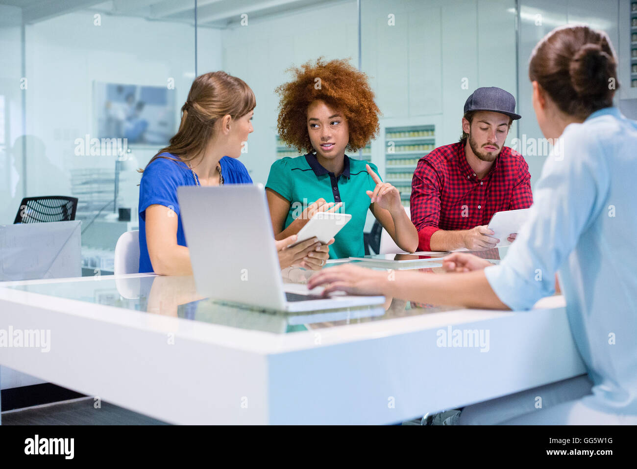 Four multiracial business people in hi-res stock photography and images ...