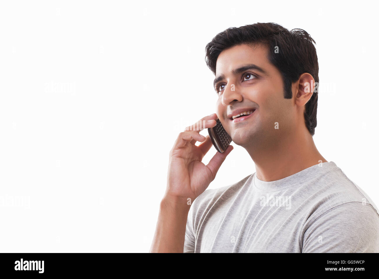 Handsome man using cell phone on white background Stock Photo - Alamy