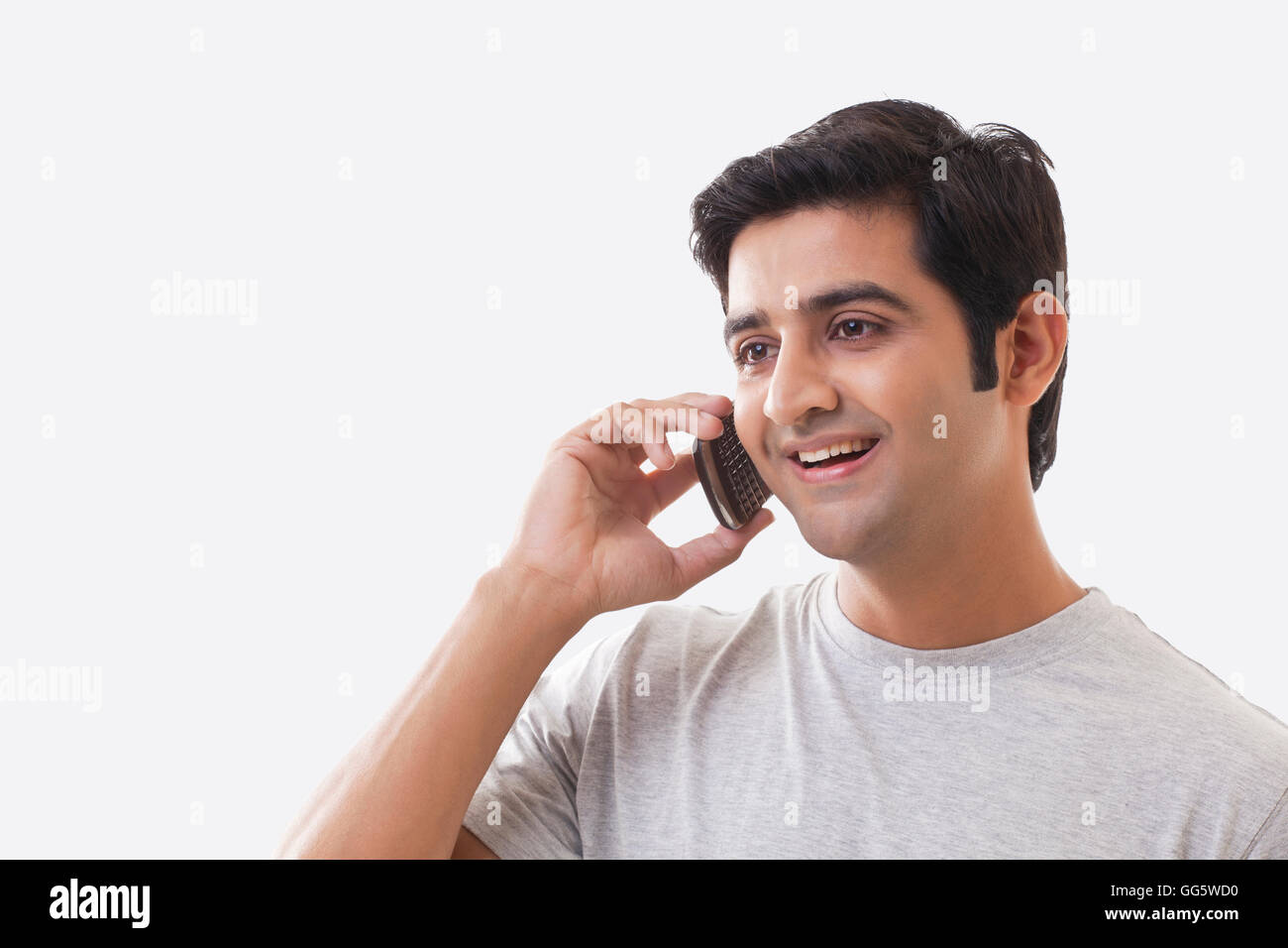 Handsome man on the phone over white background Stock Photo - Alamy
