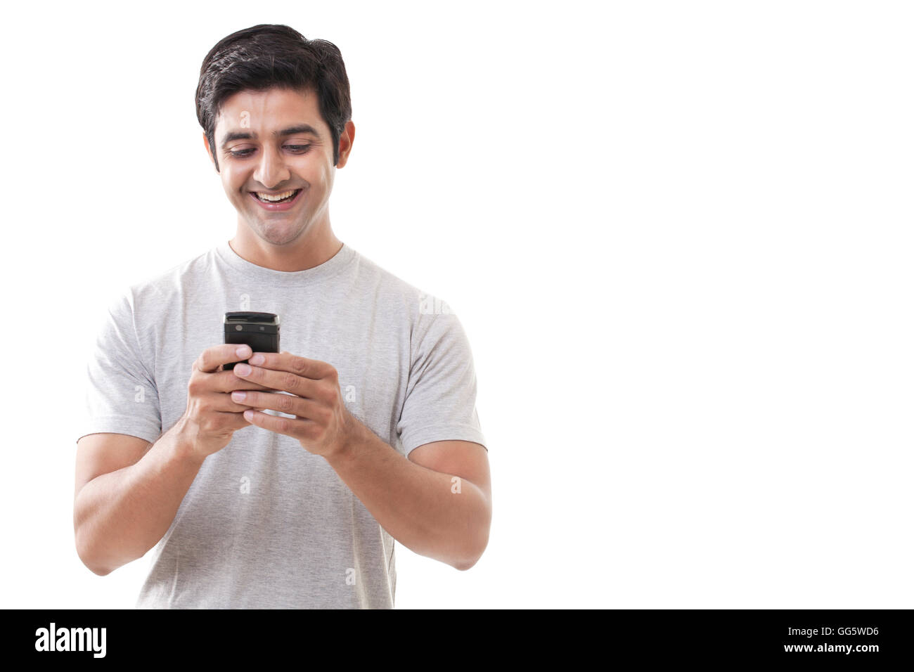 Handsome young man smiling white reading text message Stock Photo - Alamy