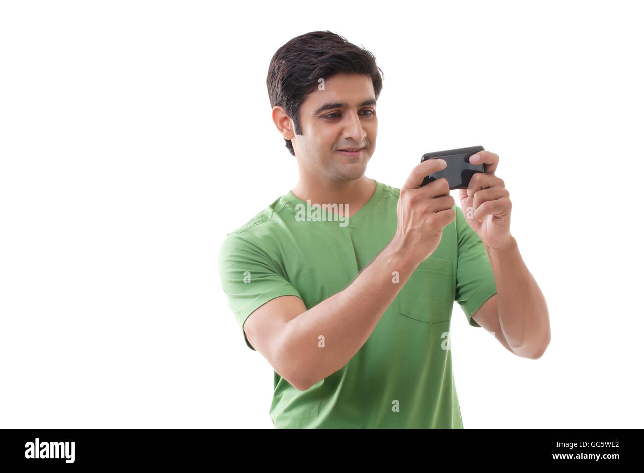 Happy young man texting message over white background Stock Photo - Alamy