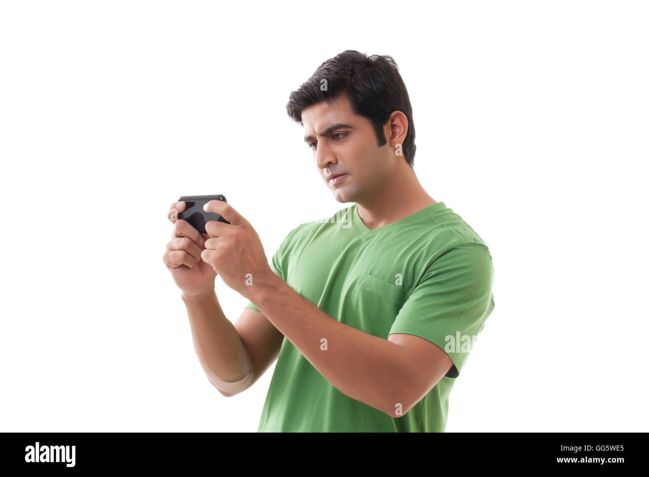 Serious man reading text message over white background Stock Photo - Alamy