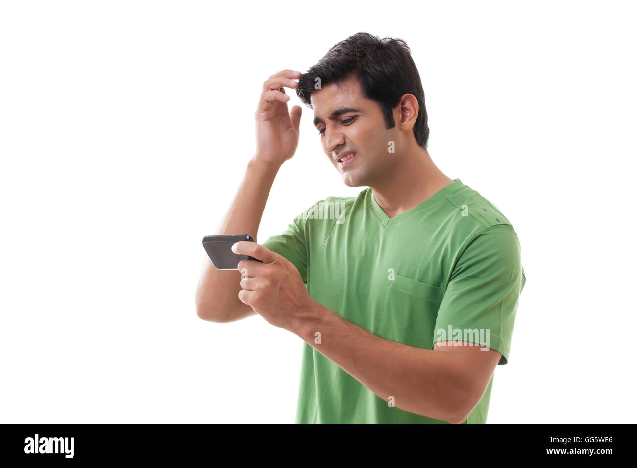 Frustrated man with cellular phone on white background Stock Photo - Alamy