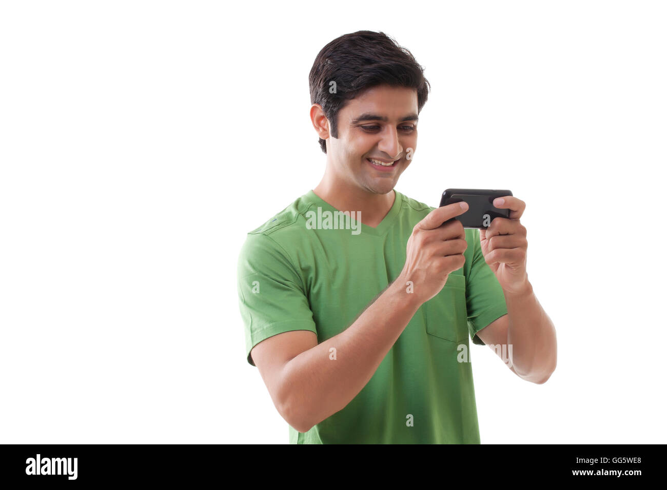 Happy young man reading text message over white background Stock Photo ...