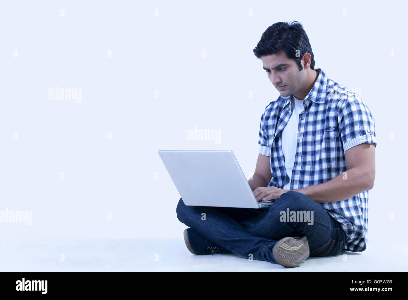 Serious university student using laptop Stock Photo - Alamy