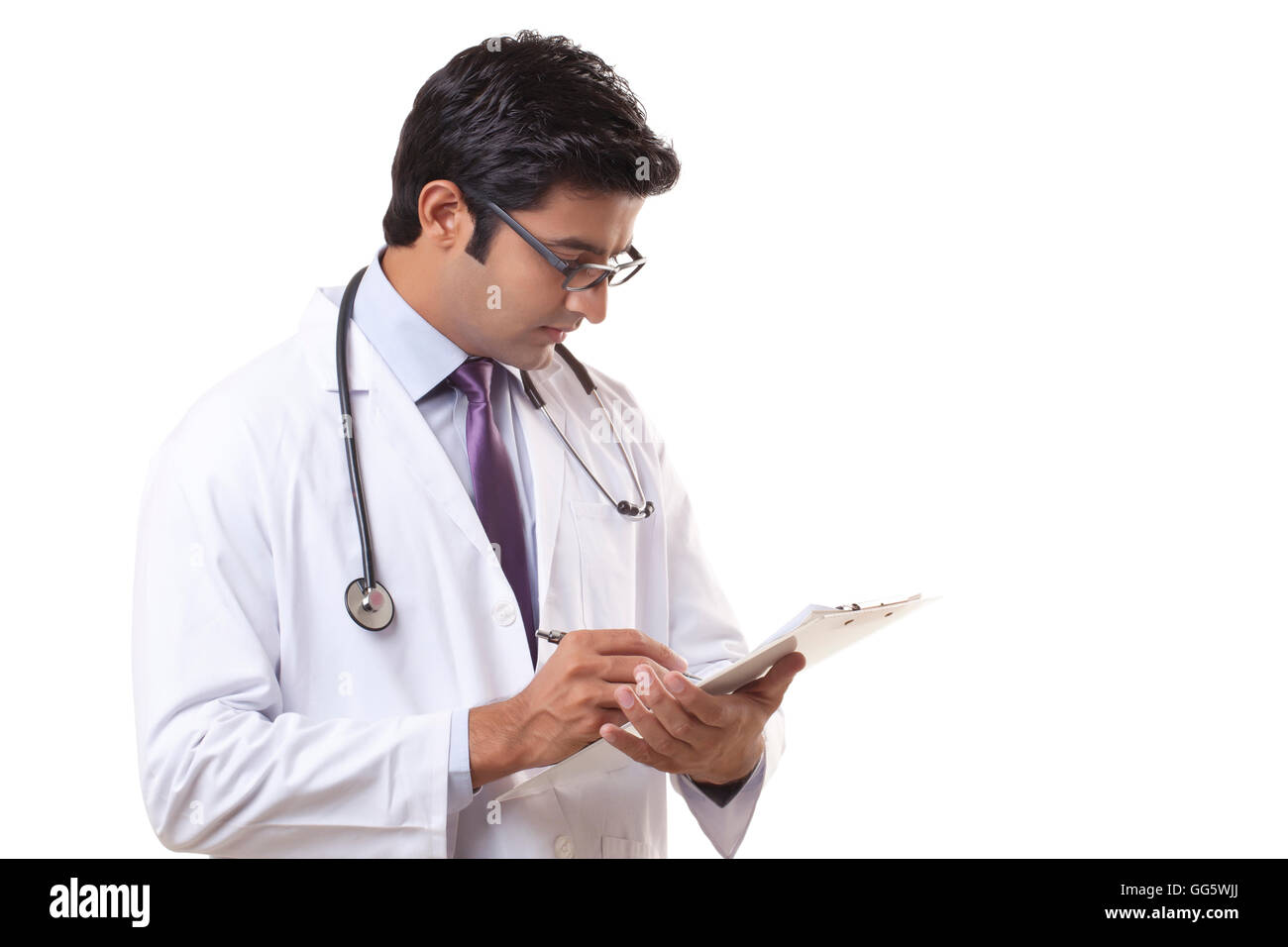 Male doctor writing on clipboard over white background Stock Photo - Alamy
