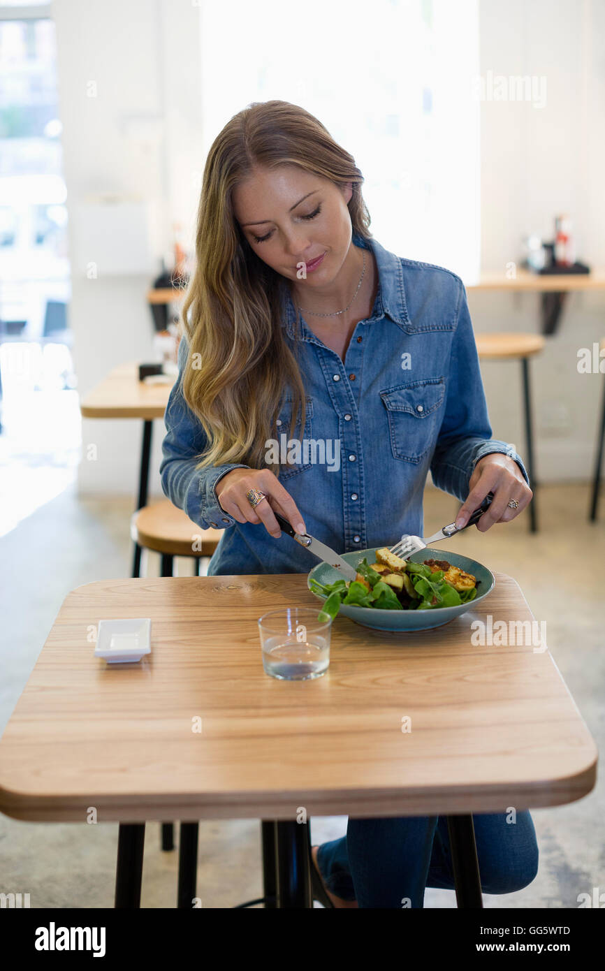 Mid adult woman smile lunch table hi-res stock photography and images ...
