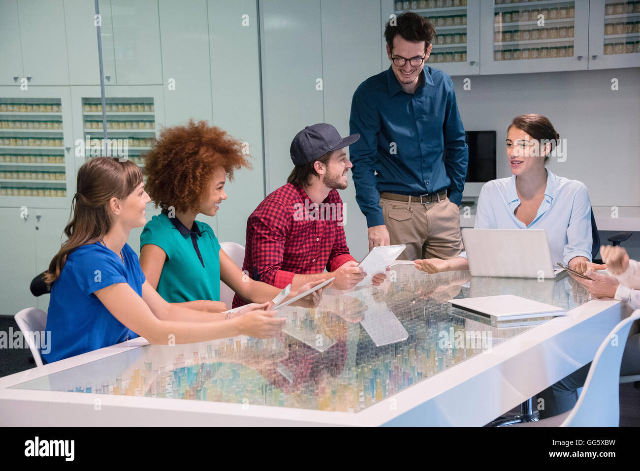 Happy business team in a conference room Stock Photo - Alamy