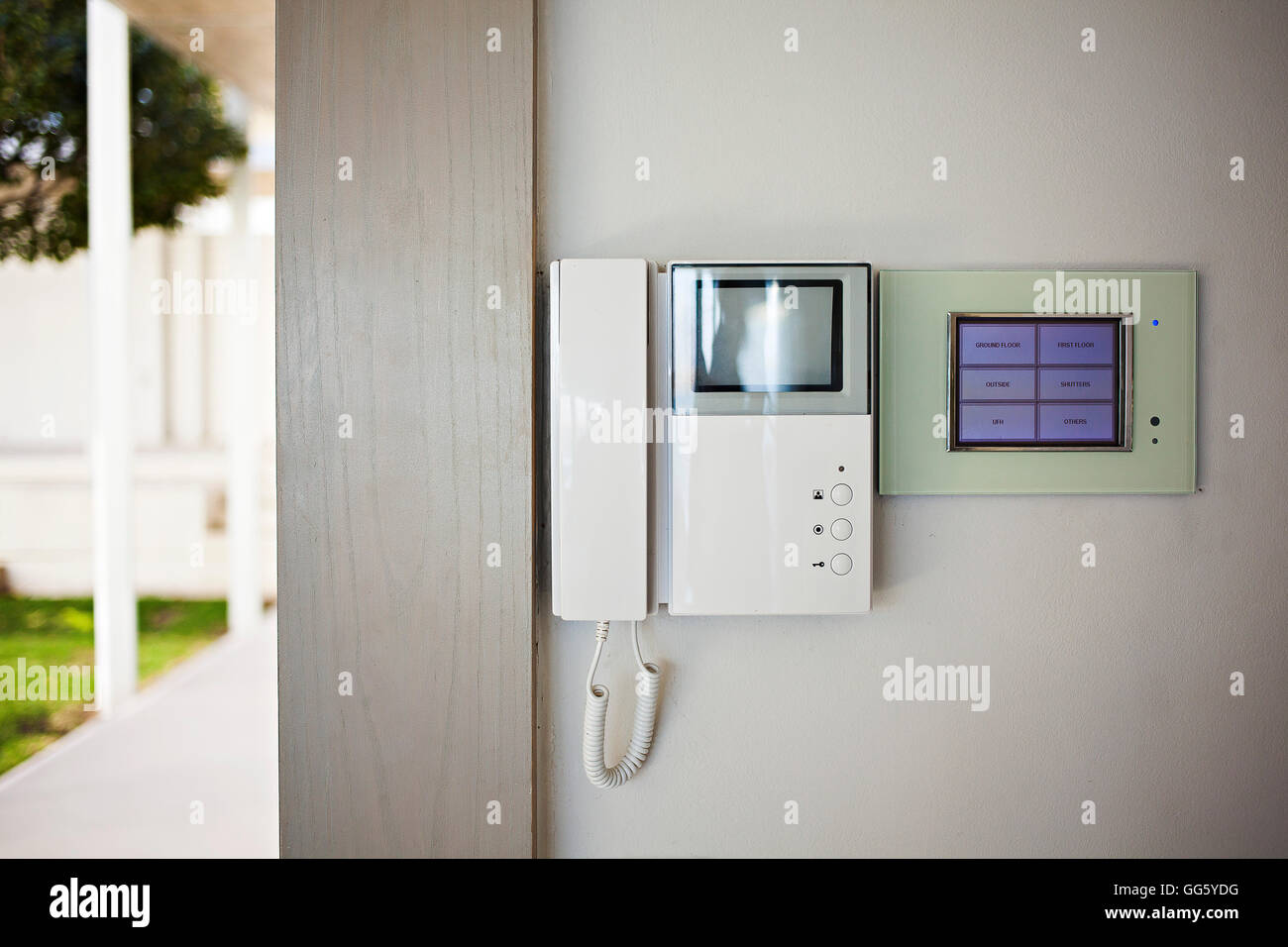 Intercom on wall at building entrance Stock Photo - Alamy